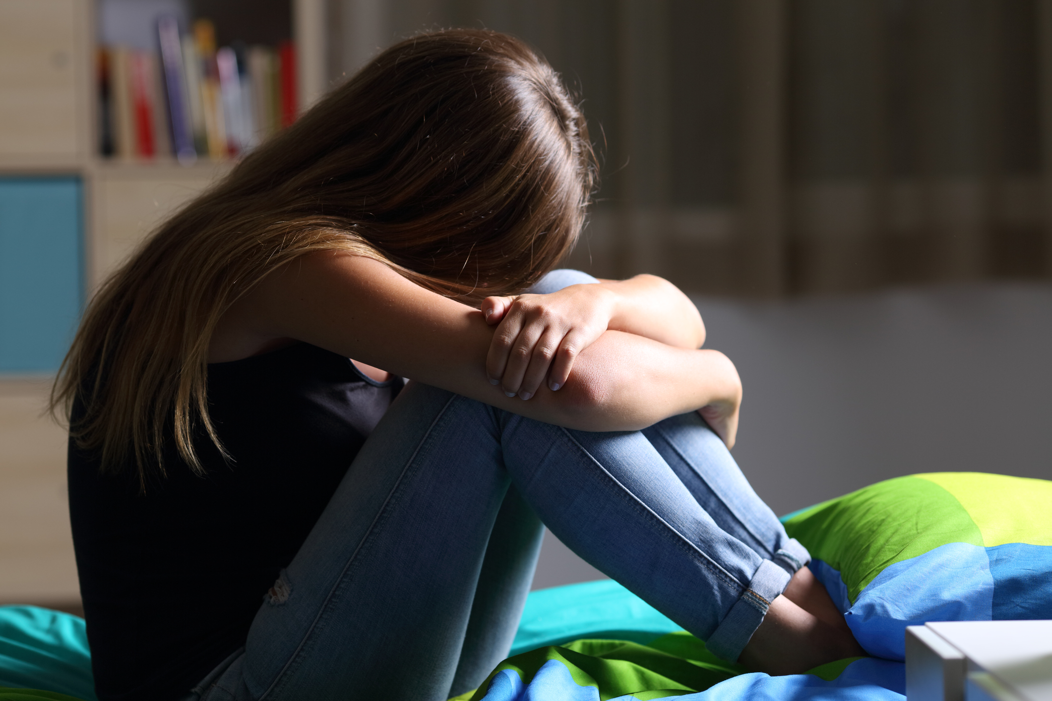 Sad teen in her bedroom - Crossroads Family Counseling Center Sad teen in her bedroom - Crossroads Family Counseling Center